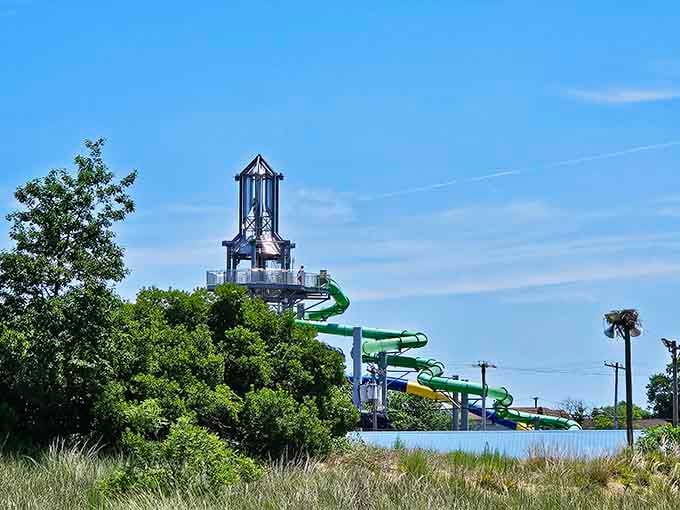 Visible from a distance through the trees, those green slides rising above the horizon are basically a lighthouse for summer fun.