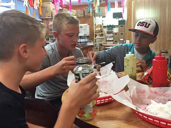 Three kids completely absorbed in their food, zero phones in sight. That right there is the highest possible review any restaurant can earn.