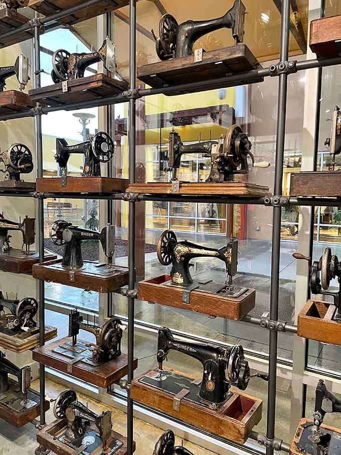 A wall of vintage Singer sewing machines displayed like fine art. The most unexpected and delightful surprise at any outlet mall.