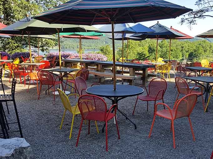 Colorful chairs, big umbrellas, and a river view that makes every bite taste even better.