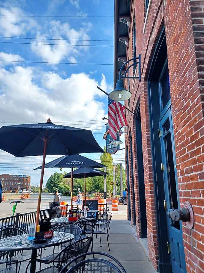 Sidewalk tables, Patron umbrellas, and an American flag overhead, the Slippery Noodle Inn welcomes you before you even open the door.