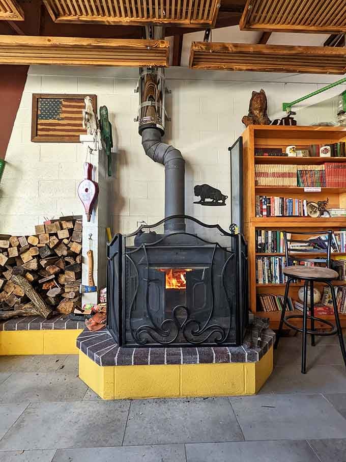 A cozy wood-burning stove surrounded by books creates the reading nook of your dreams, slippers not included.