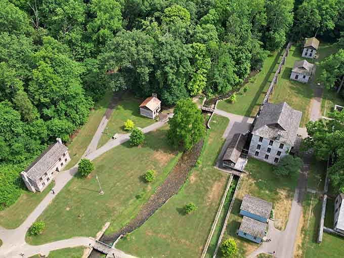 From above, the pioneer village looks like a living map, stone buildings and green paths laid out like a quiet puzzle.