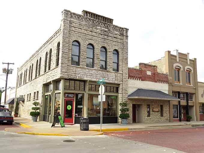 A limestone two-story corner building with arched windows, downtown Stephenville's architecture makes every intersection feel like a postcard moment.
