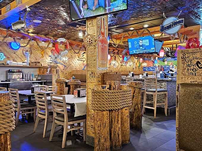 Colorful neon signs, rope-wrapped columns, and TVs everywhere you look. This room is having more fun than you are, and it wants you to catch up.