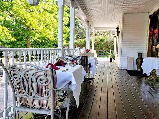 White linen tables on a wraparound porch, where a good meal and fresh Virginia air come as a package deal.