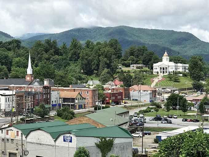 The courthouse watches over downtown from its perch while mountains stand guard, creating Sylva's signature postcard-perfect view daily.
