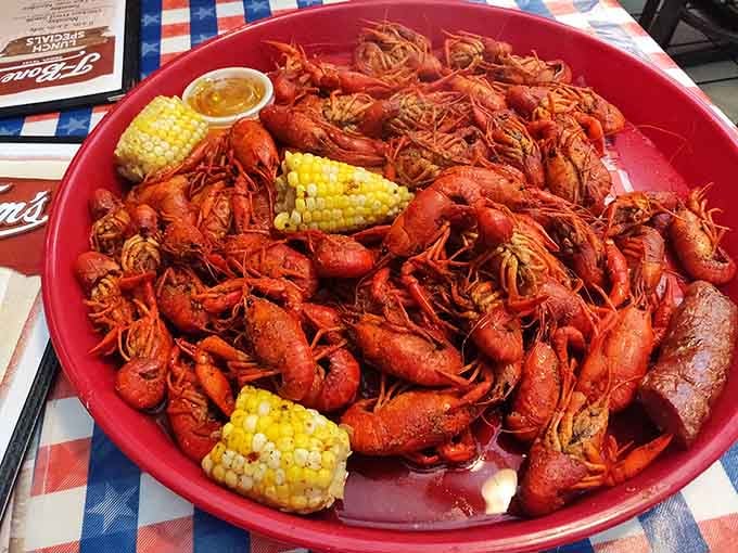 A mountain of boiled crawfish with corn and sausage. This is not a meal, this is a Gulf Coast celebration in a bowl.