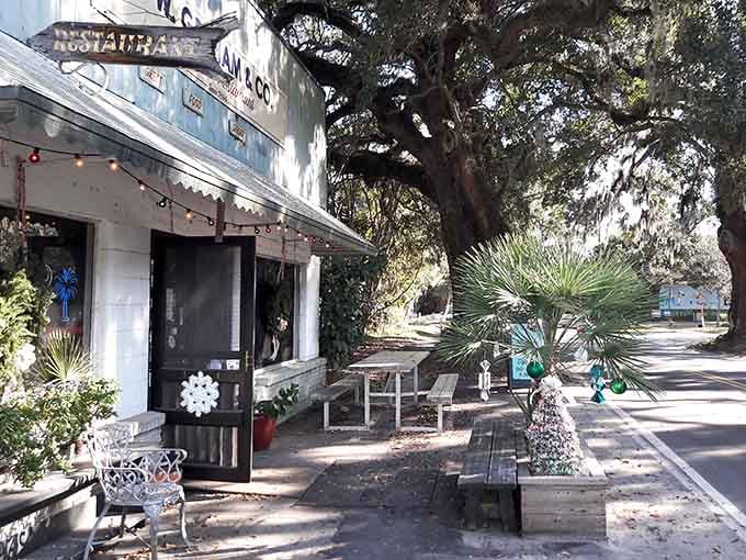 Outdoor seating shaded by a massive live oak, where even waiting for your table feels like a reward.