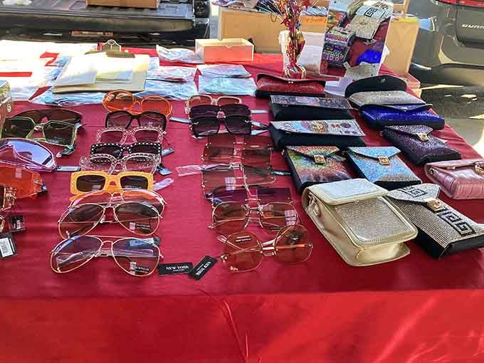 Aviators, bold frames, and sparkly clutches spread across a red tablecloth, one stop here and your whole summer accessory situation is completely sorted.
