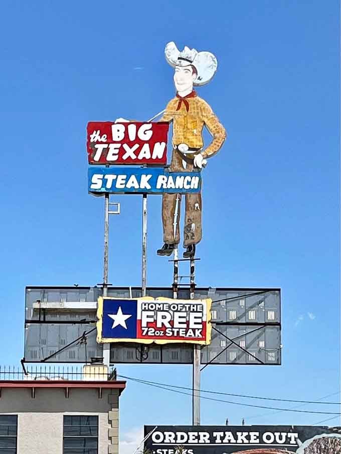 That cowboy sign has been pointing hungry travelers toward a free 72-ounce steak for decades.
