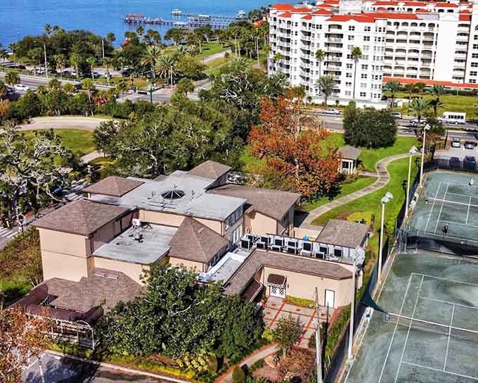 From above, The Casements reveals its full story, historic mansion, lush grounds, and the Halifax River just beyond.