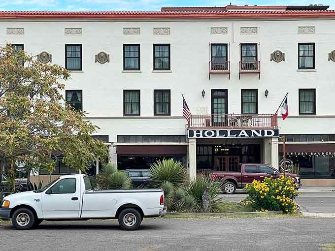 Pickup trucks parked out front, yucca plants standing guard. The Holland Hotel fits Alpine like it was always meant to be here.