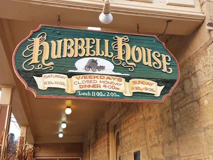 Hand-painted signage announces the hours with old-world flourish, because even the schedule deserves a touch of vintage elegance here.