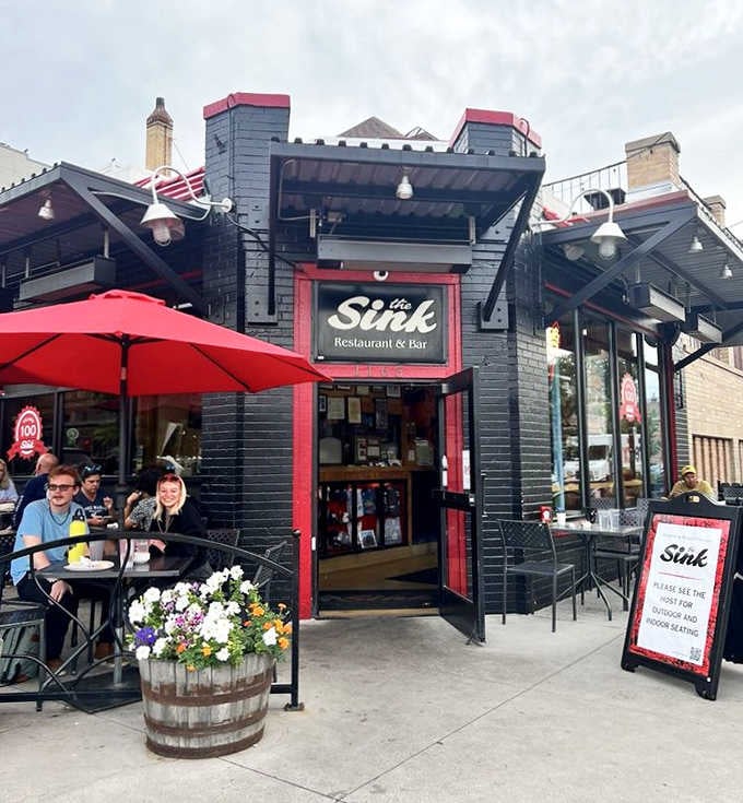 Barrel planters, red umbrellas, and a chalkboard sign. The Sink's exterior is as inviting as the food inside.