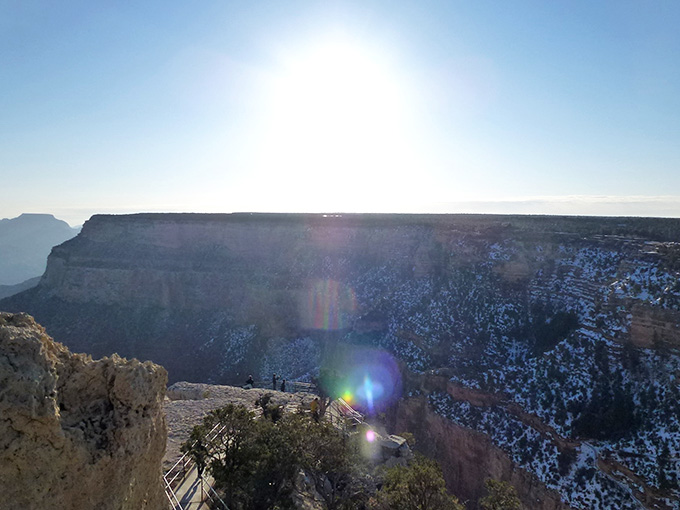 Sunlight blazing over a snow-kissed canyon rim, the kind of scene that makes you forget what you were worried about.