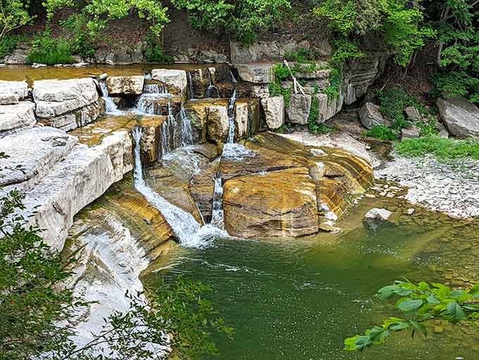 Water threading over amber and white rock into a jade-green pool, this gorge looks like nature spent extra time on this particular corner of New York.