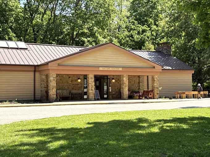 The Turkey Run Nature Center welcomes curious visitors with stone walls and shaded benches, a perfect first stop.
