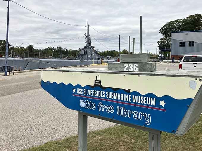 A little free library in front of a legendary submarine: only in Michigan do history and community charm share the same parking lot.