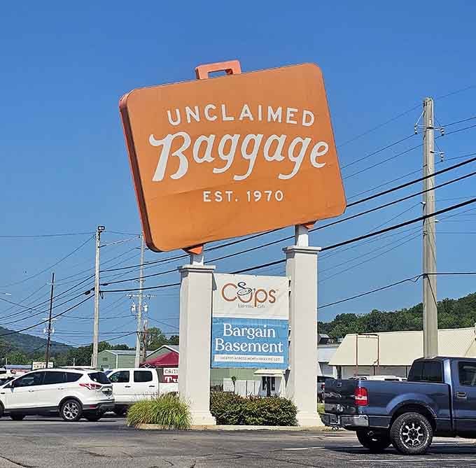 That giant orange suitcase sign is basically Alabama's way of saying, "Yes, this place is absolutely real."