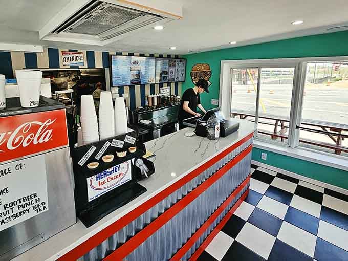 A crisp counter, a Coca-Cola sign, and Hershey's Ice Cream on deck. Classic American drive-in energy, perfectly preserved.