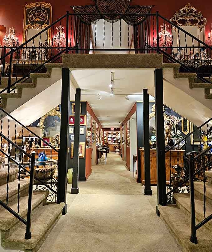 The Glitz antique shop interior, where chandeliers, gilded mirrors, and sweeping staircases make you feel like you've walked into a very fancy dream.