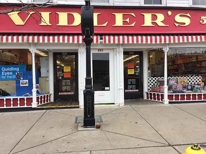 That bold gold lettering above the entrance at 692 Main Street has been welcoming curious visitors through these doors ever since.