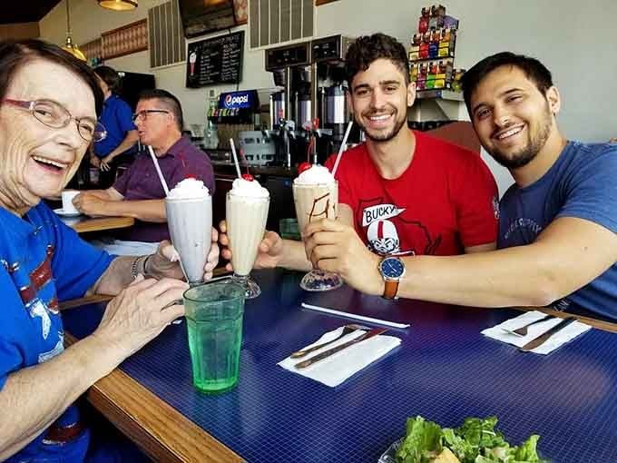 When the milkshakes arrive in tall glasses with cherries on top, everyone at the table becomes an instant friend.