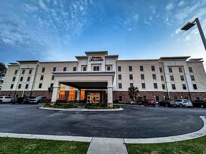 The Hampton Inn glowing warmly against a dusky sky, a reliable, comfortable landing spot after a full day of Lowcountry exploring.