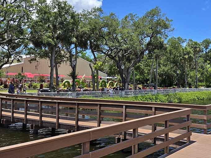 From the boardwalk, the whole scene unfolds: food stalls, red tables, naga sculptures, and pure Tampa magic.