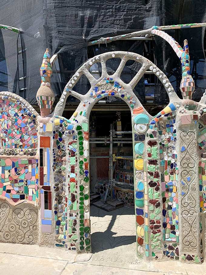 Every arch, every embedded dish, every pressed shell in this entrance was placed by hand, one piece at a time, over thirty-three years.