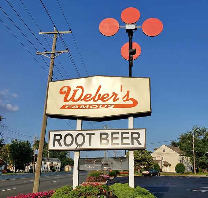 Under a deep summer blue sky, that classic Weber's Famous sign stands tall, still proud, still pointing the way home.