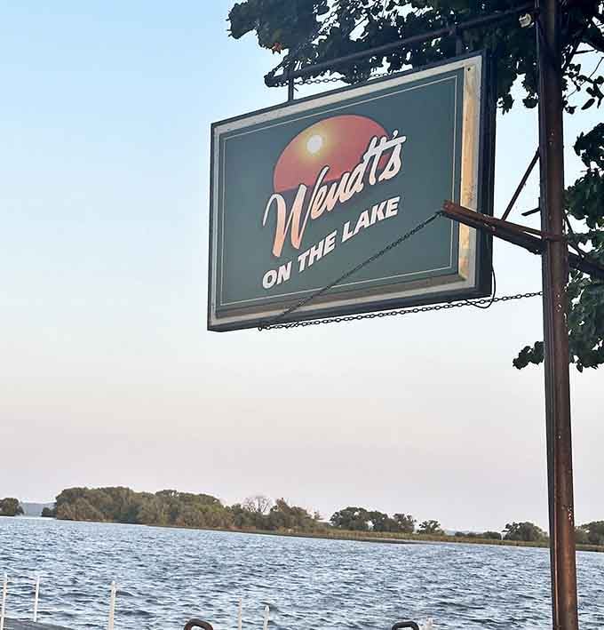 That vintage sign hanging over the lake says everything. You've arrived somewhere genuinely special.