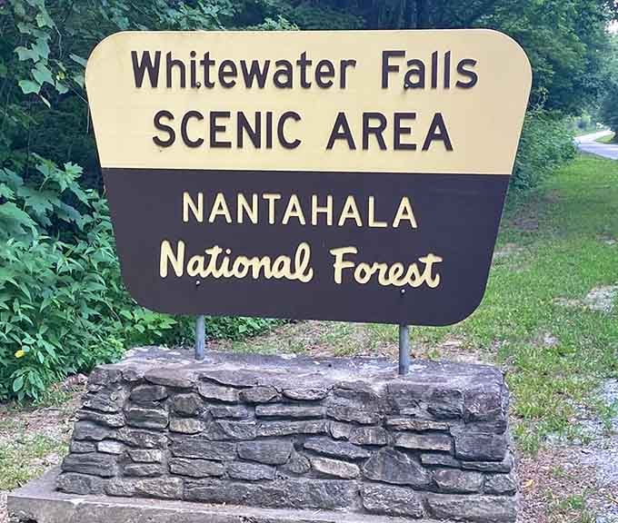 The Whitewater Falls Scenic Area sign welcomes you to Nantahala National Forest, home of the East's tallest waterfall.