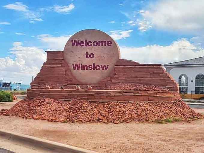 That welcome sign isn't just sandstone and paint. It's Winslow saying, "We've been expecting you, and we're glad you're here."