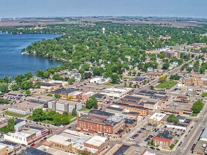 Worthington from above, where a sparkling lake meets a thriving downtown and wind turbines hum quietly on the horizon.