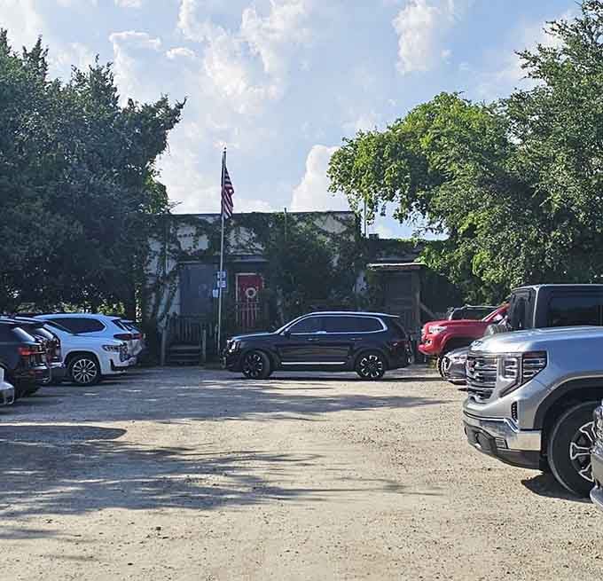 A packed gravel lot on a sunny day tells you everything you need to know before you even walk through the door.