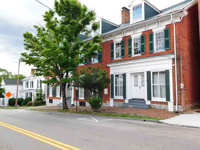 Take a pleasant stroll past these charming, historic brick homes featuring classic white trim and lovely green window shutters.
