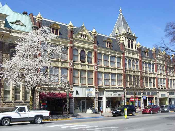 Spring blossoms frame Victorian architecture like nature's own picture frame, creating a scene worthy of a postcard.