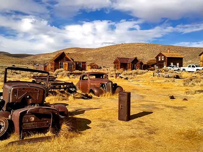 Rusty cars and weathered wood tell a story no history book could match quite this well.
