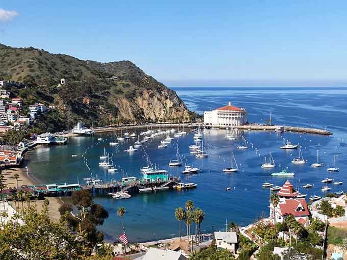 Avalon's harbor sparkles like a Mediterranean dream, with the iconic Casino standing guard over sailboats below.