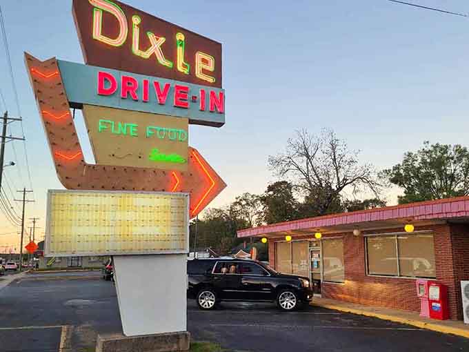 That glowing neon sign at dusk is basically Greenwood's most delicious invitation you'll ever receive.