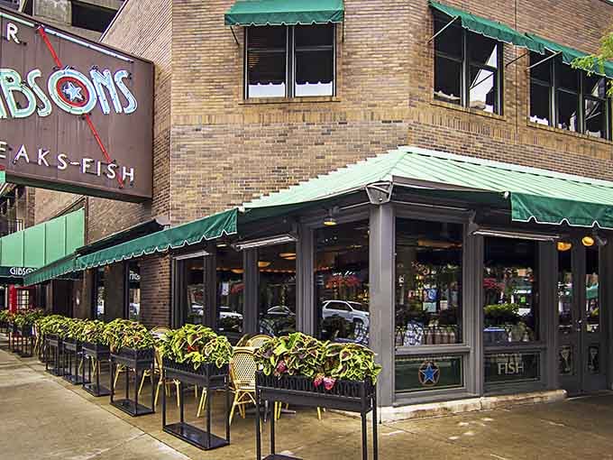 Green awnings, lush flower boxes, and a corner perch on Rush Street that practically whispers, "Come on in, you deserve this."
