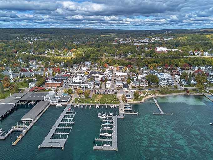 Harbor Springs from above: crystal-clear turquoise water, sailboats, and autumn color stealing the show effortlessly.