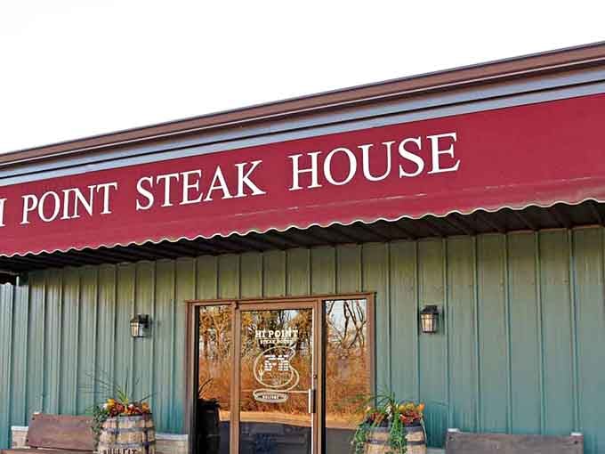 That bold red awning and those rustic wooden barrels say one thing loud and clear: serious steak lives here.