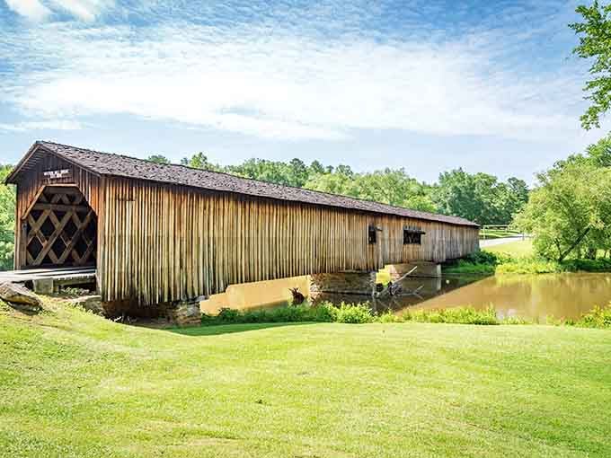 Georgia's longest covered bridge stretches majestically over calm waters, proving size really does matter when it comes to charm.