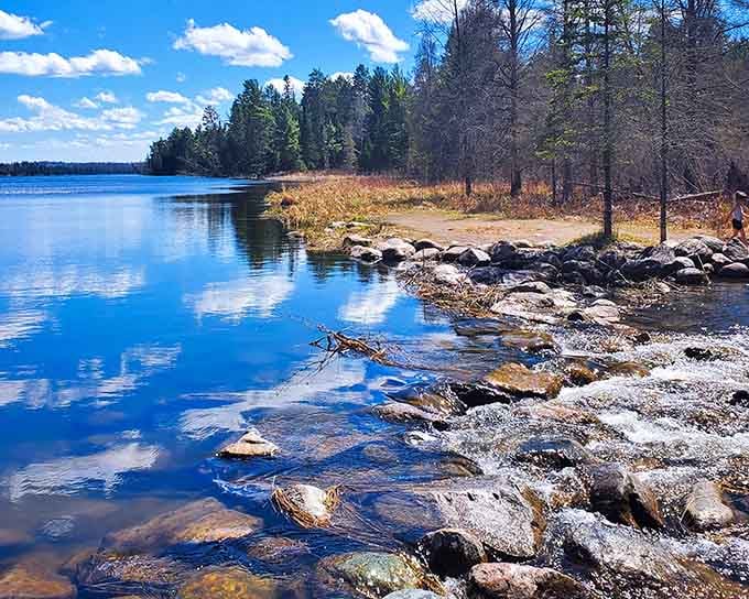 Crystal-clear water tumbles over ancient rocks where the mighty Mississippi River humbly begins its long journey south.