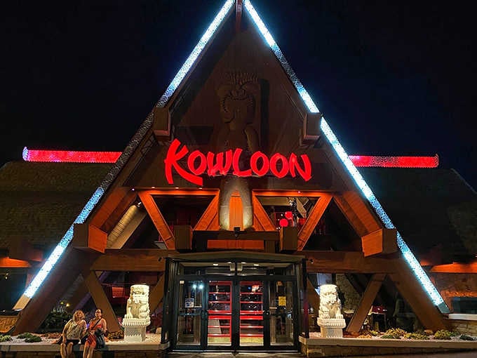 That glowing red neon against the night sky makes this tiki palace look like Vegas met Polynesia.