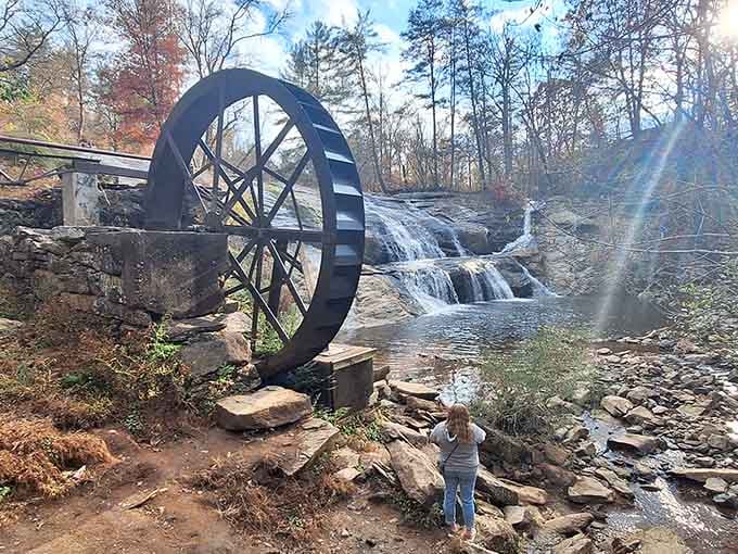 That historic mill wheel and cascading waterfall create a scene straight out of a Norman Rockwell painting.