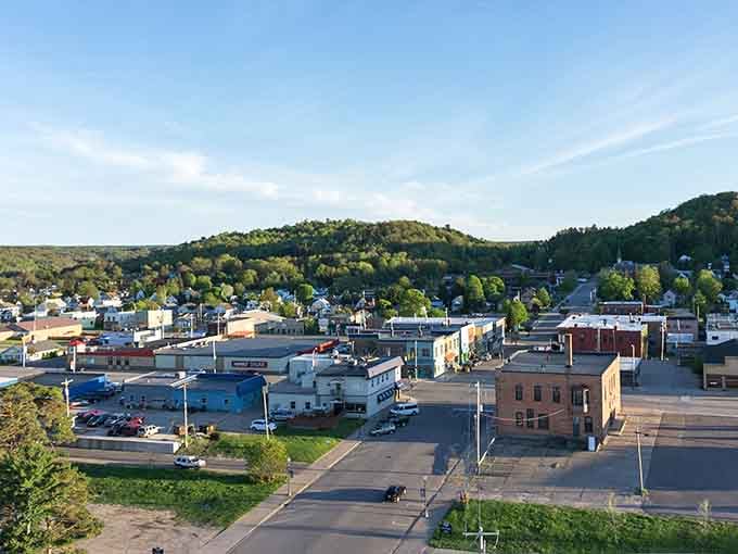 Rolling hills embrace this Upper Peninsula gem where small-town charm meets Lake Superior's stunning blue waters.